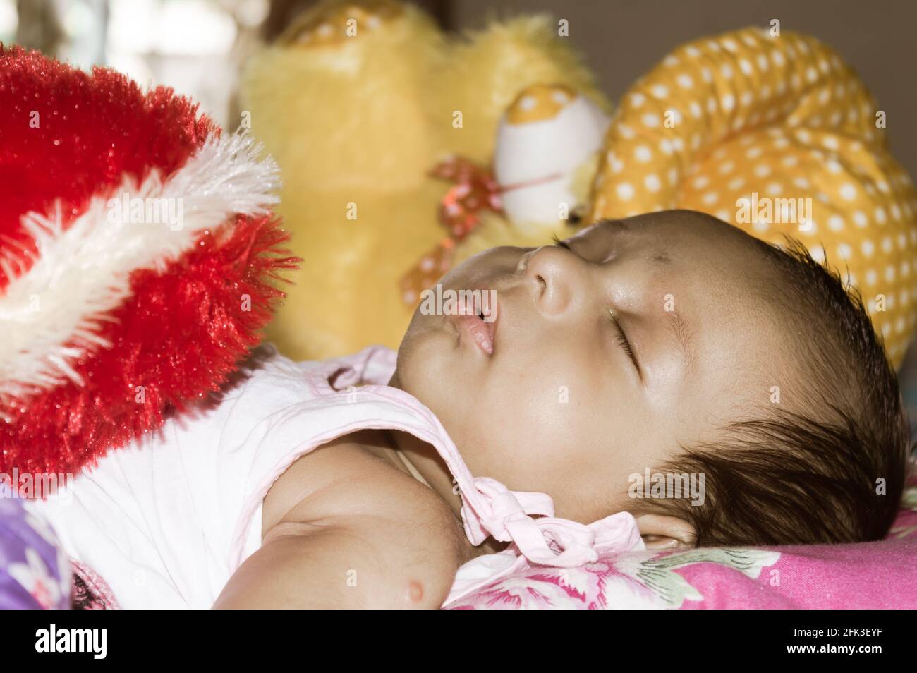 Close up face of cute sleeping newborn baby boy in drowsy eyes sleepy ...