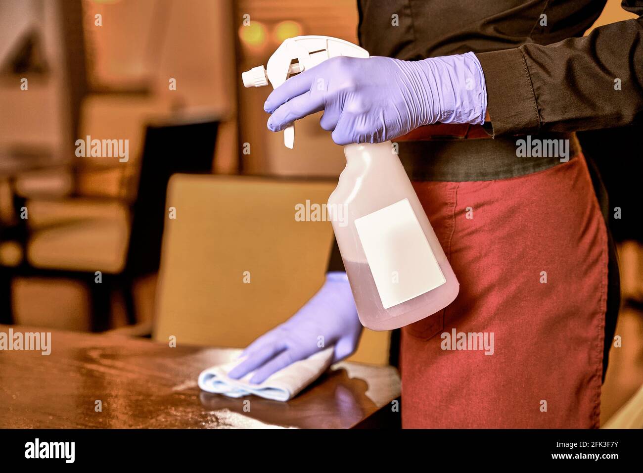 Server with wiping cloth cleaning a restaurant table Stock Photo - Alamy