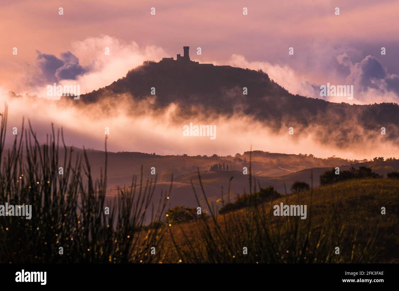 Rocca di Radicofani's main tower fortification is covered with morning ...