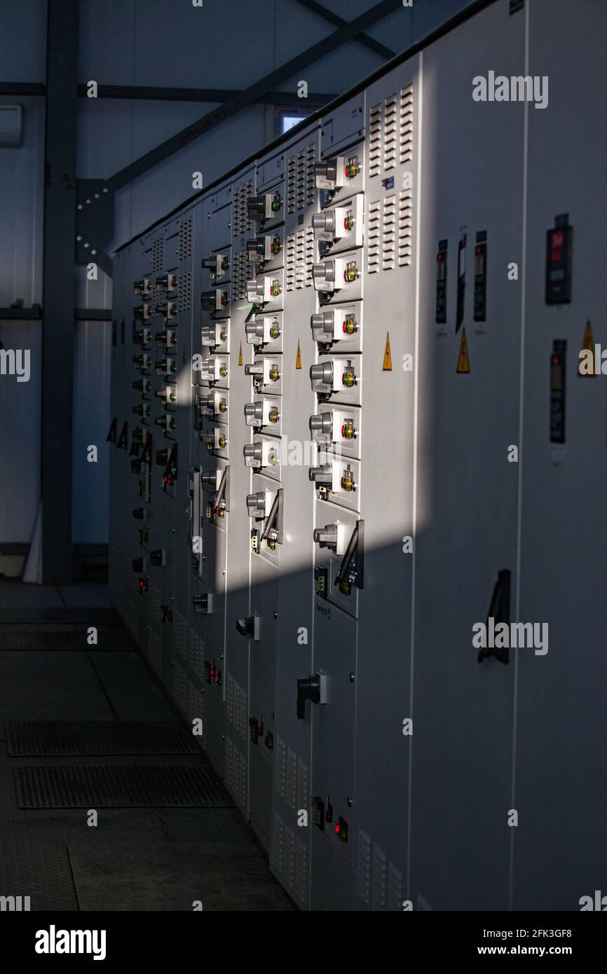 Electric cabinet in light and shadow. Control room of mining and ...