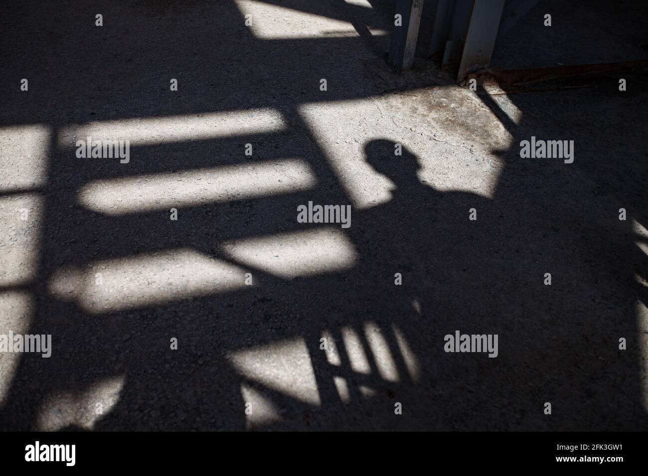 Abstract industrial background. Light and shadow of stair and worker ...
