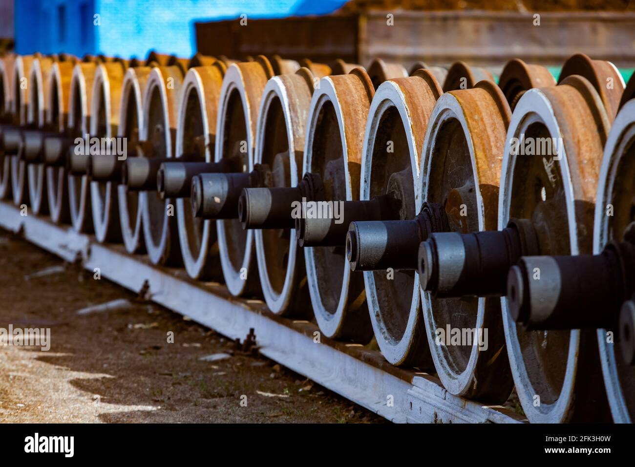 Rusted steel railroad carriages wheels on repair factory workshop ...