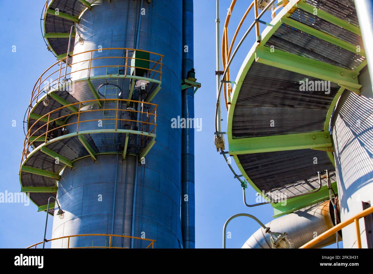 Close up photo of oil refinery column (distillation tower). Oil ...