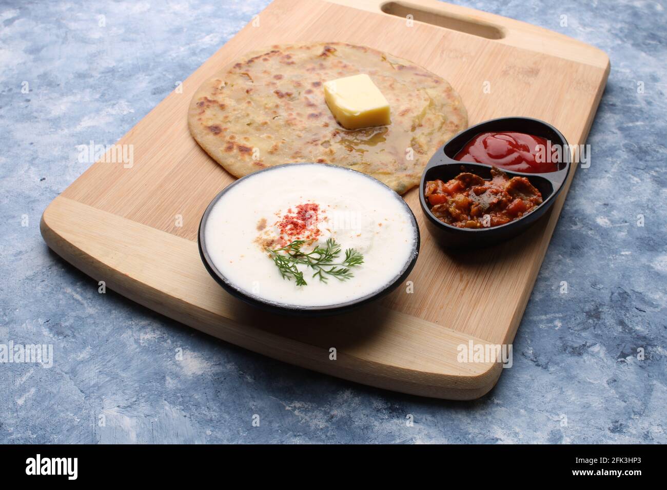Traditional Indian food Aloo paratha or potato stuffed flat bread ...