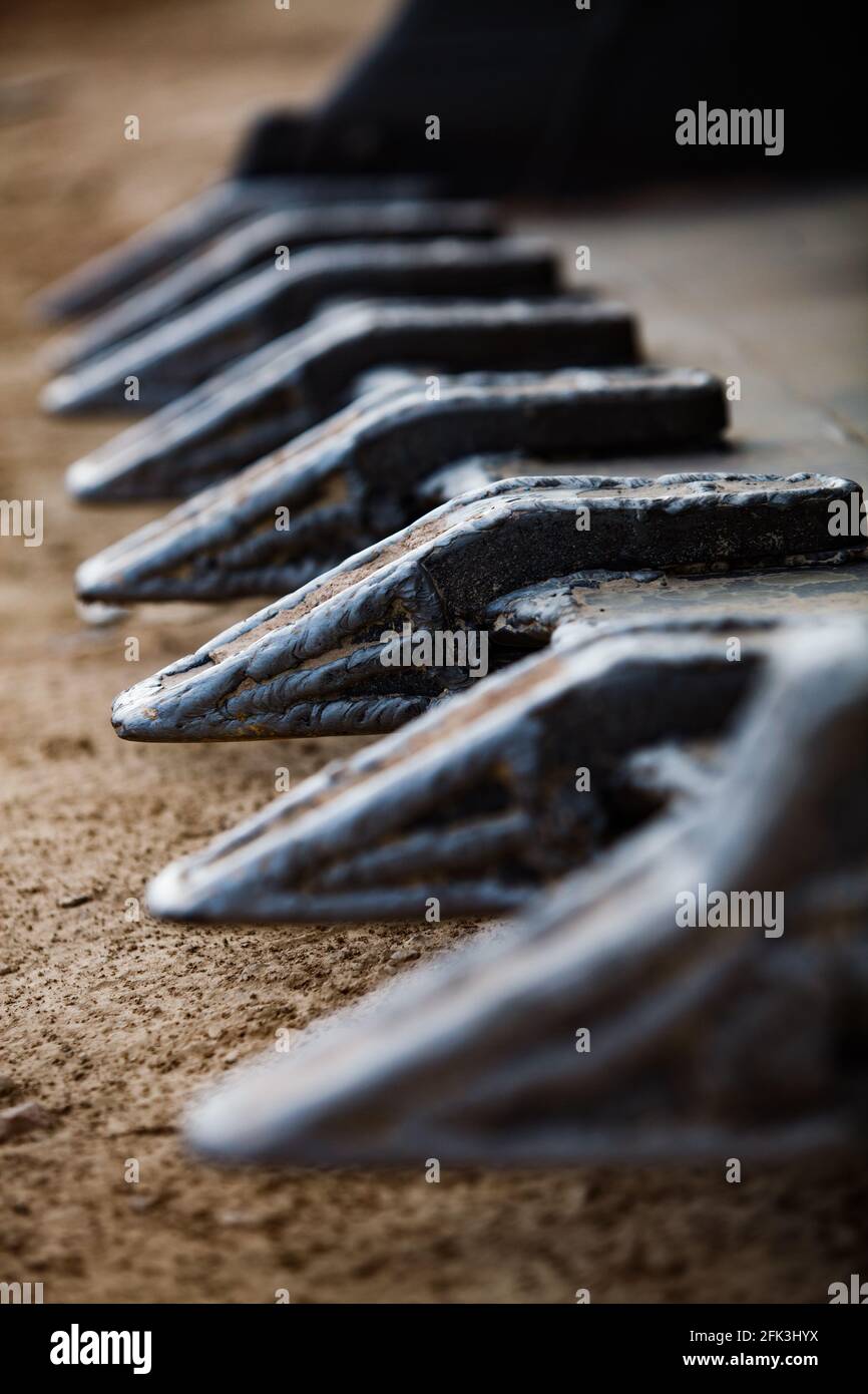 Excavator bucket teeth close up teeth. Low depth-of-field. Selective ...