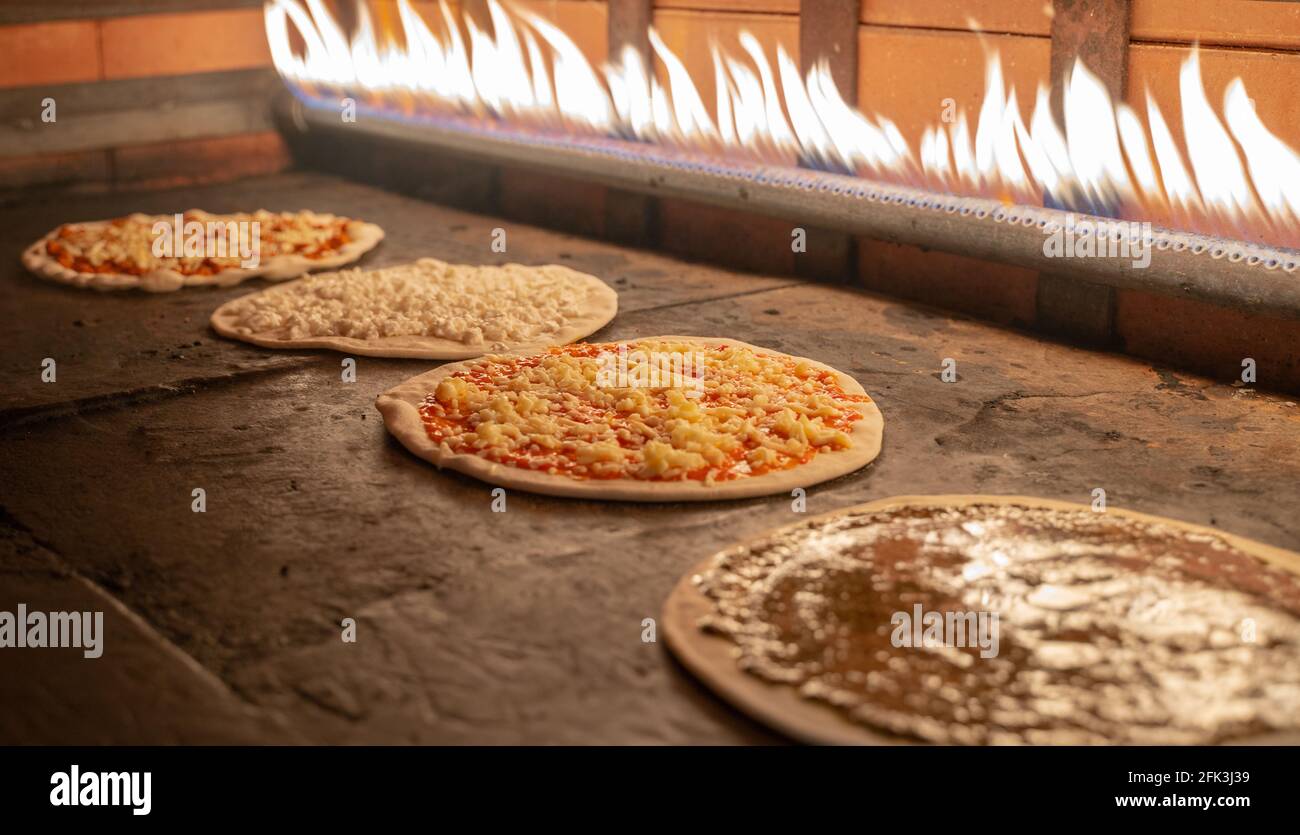Arabic traditional food Manakish baked in the gas oven Stock Photo - Alamy