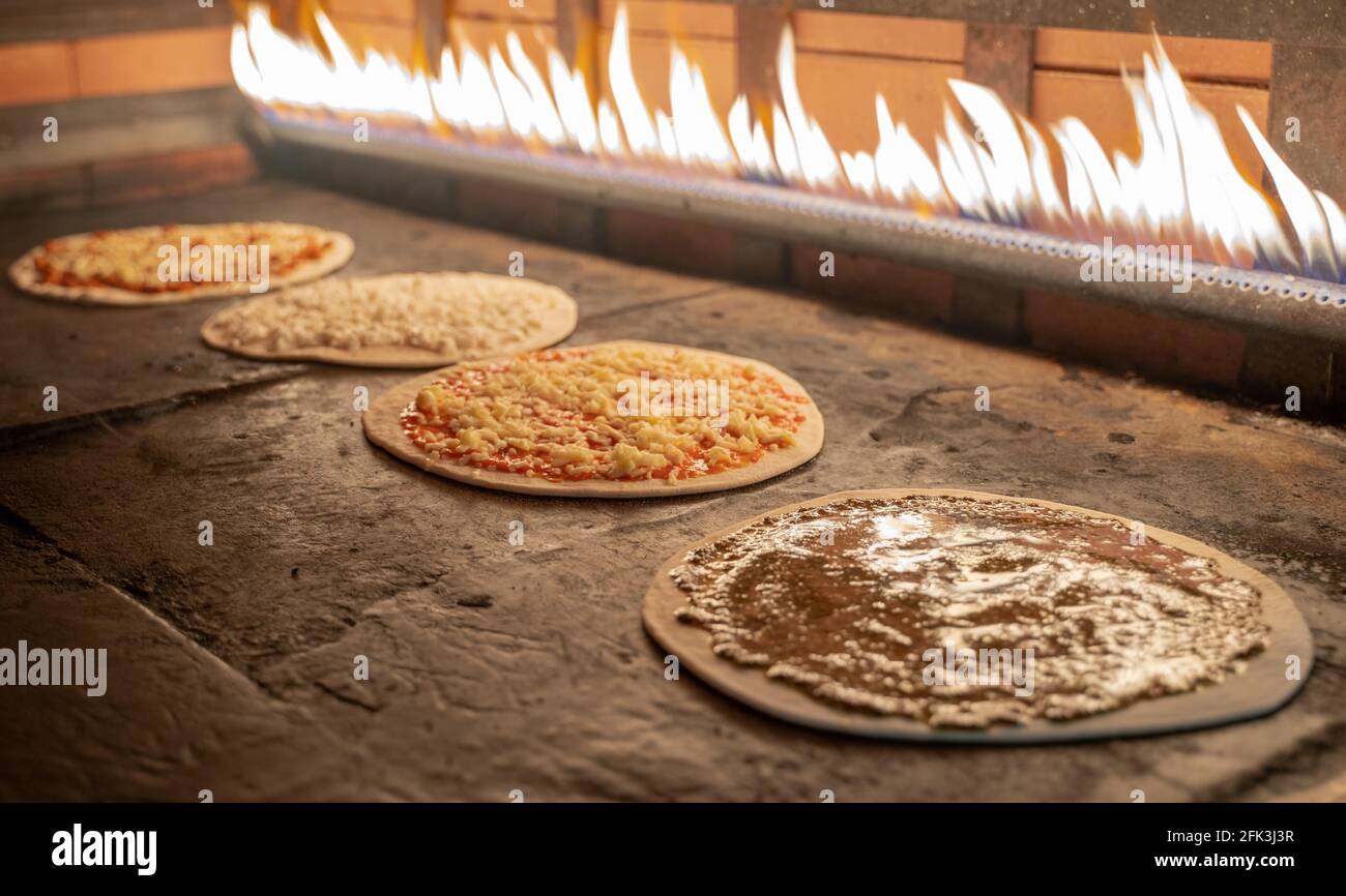Arabic traditional food Manakish baked in the gas oven Stock Photo - Alamy