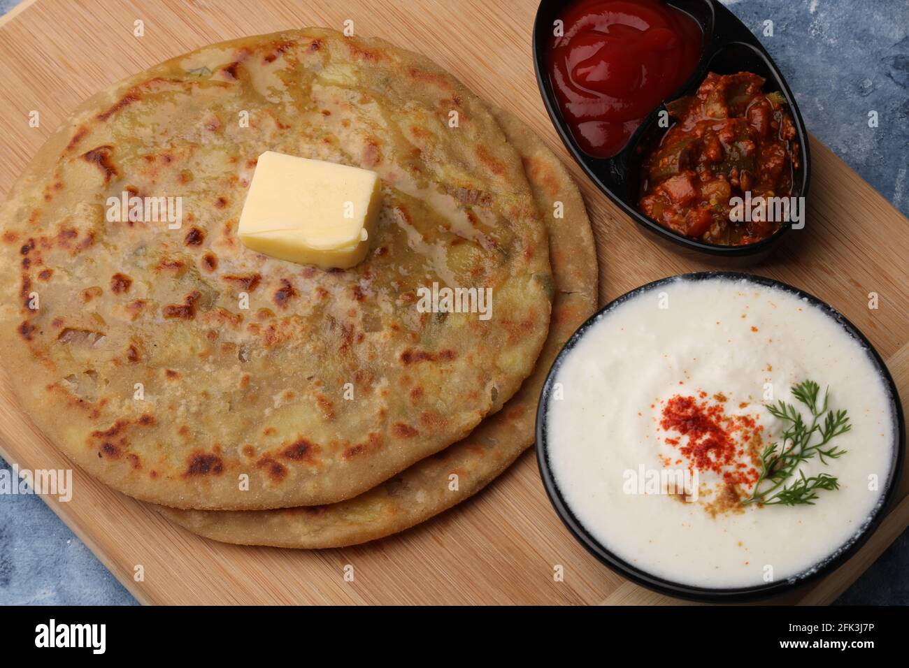 Traditional Indian food Aloo paratha or potato stuffed flat bread ...