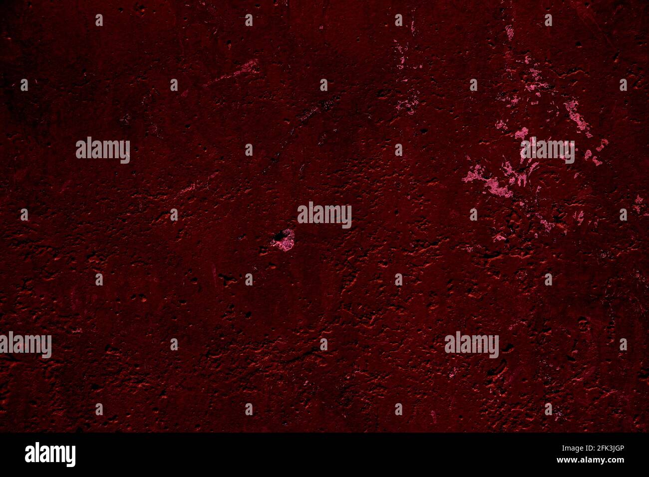 Crimson colored wall background with textures of different shades of ...