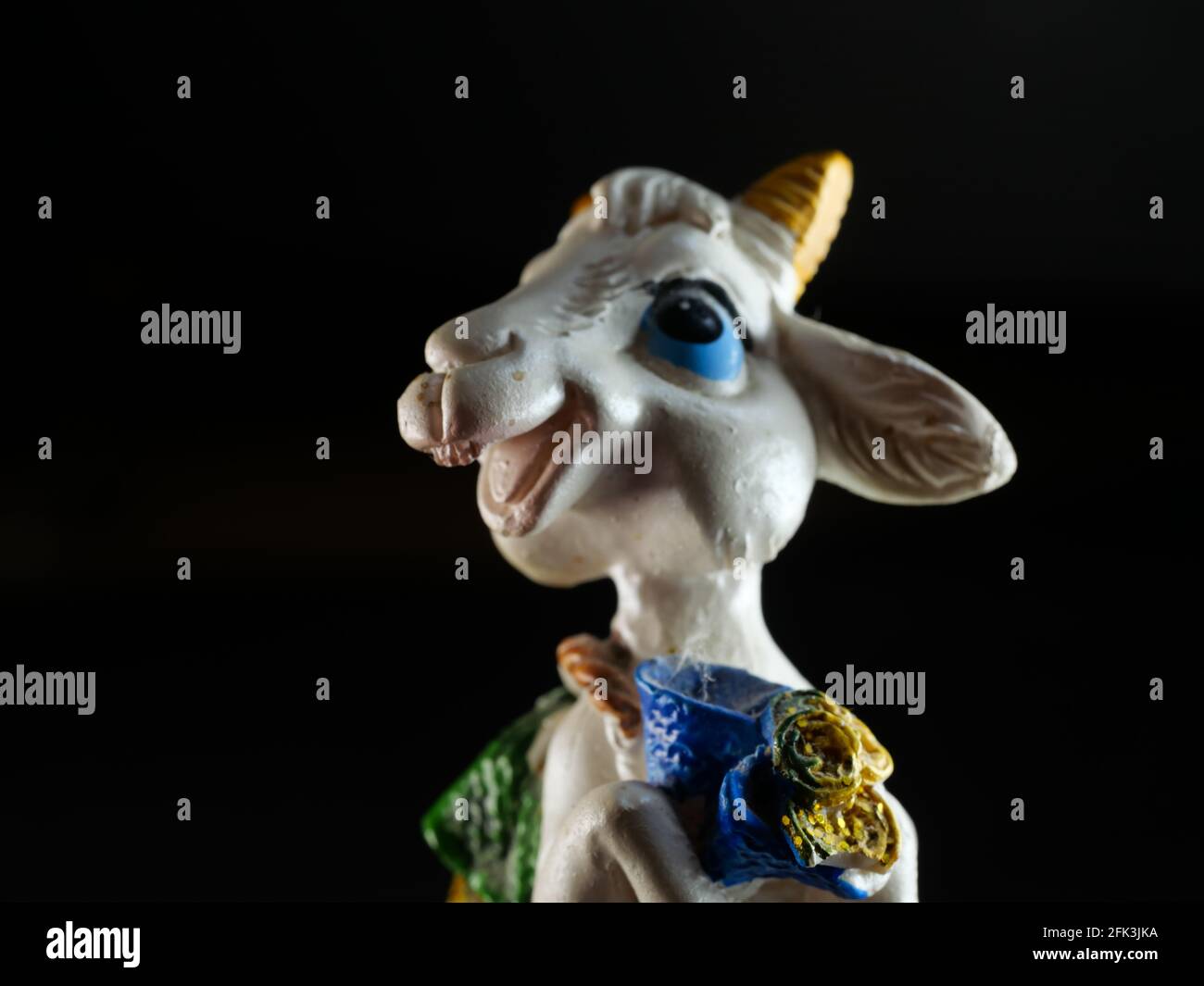 Studio shot of a colorful ceramic goat on black background Stock Photo ...