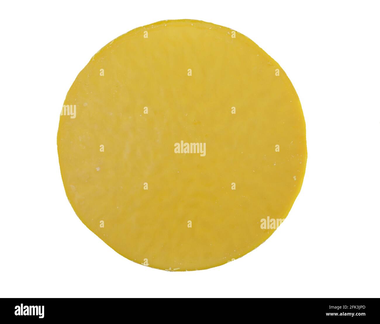 Round yellow wax block isolated Stock Photo - Alamy