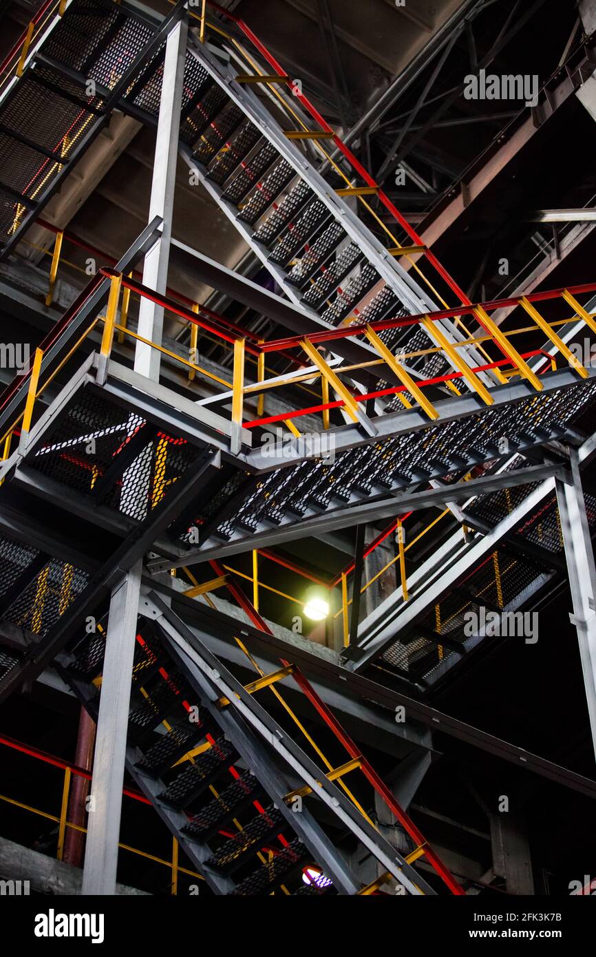 Metal stairs in factory workshop. Abstract industrial background Stock ...