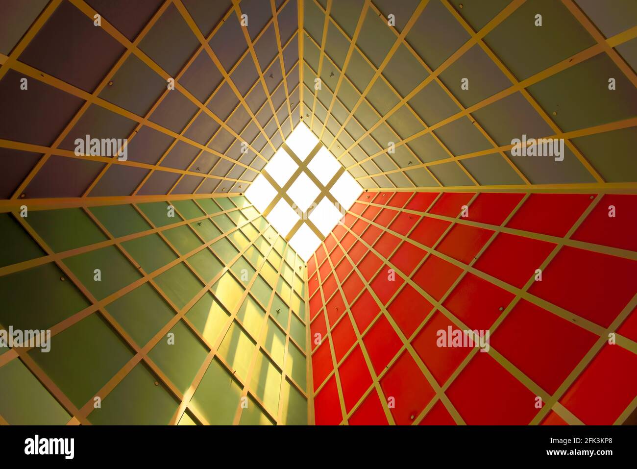 Vertical view of skylight in tower with strong geometric patterns as ...