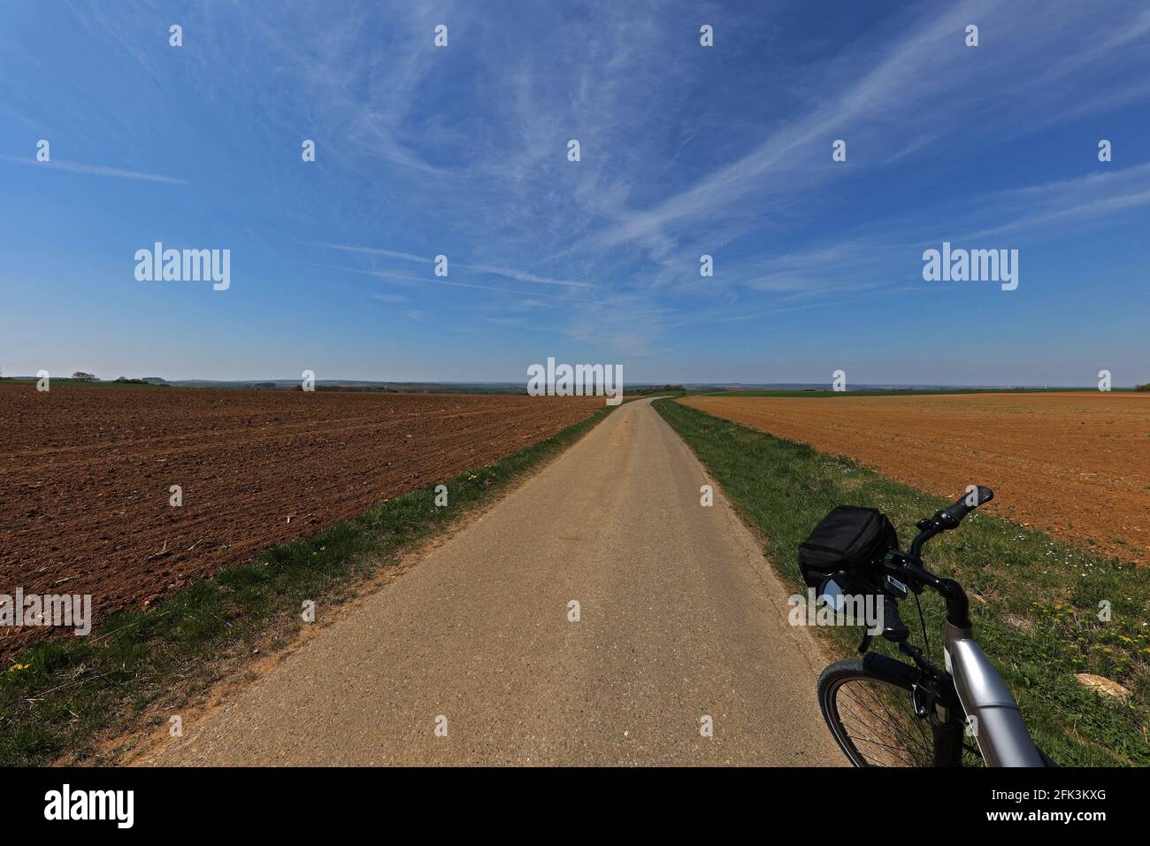 Spring landscape with an e-bike on the way Stock Photo - Alamy