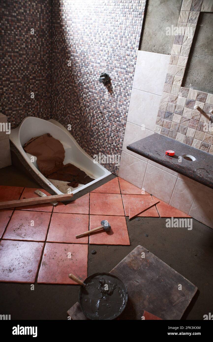 Ceramics tile work underway in an under construction washroom Stock ...