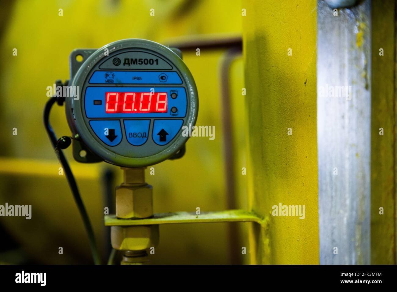 Close up photo of electronic flow meter with digital display. Blurred ...