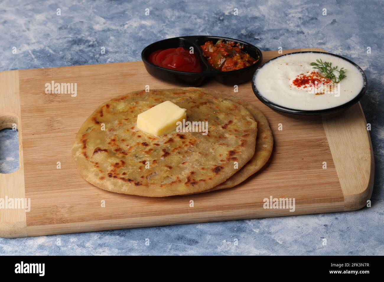 Traditional Indian food Aloo paratha or potato stuffed flat bread ...