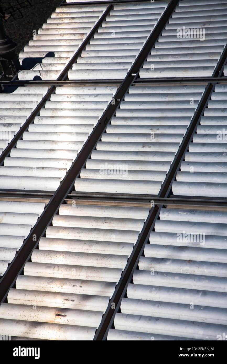 Abstact industrial background. Close up of steel roof system on oil ...