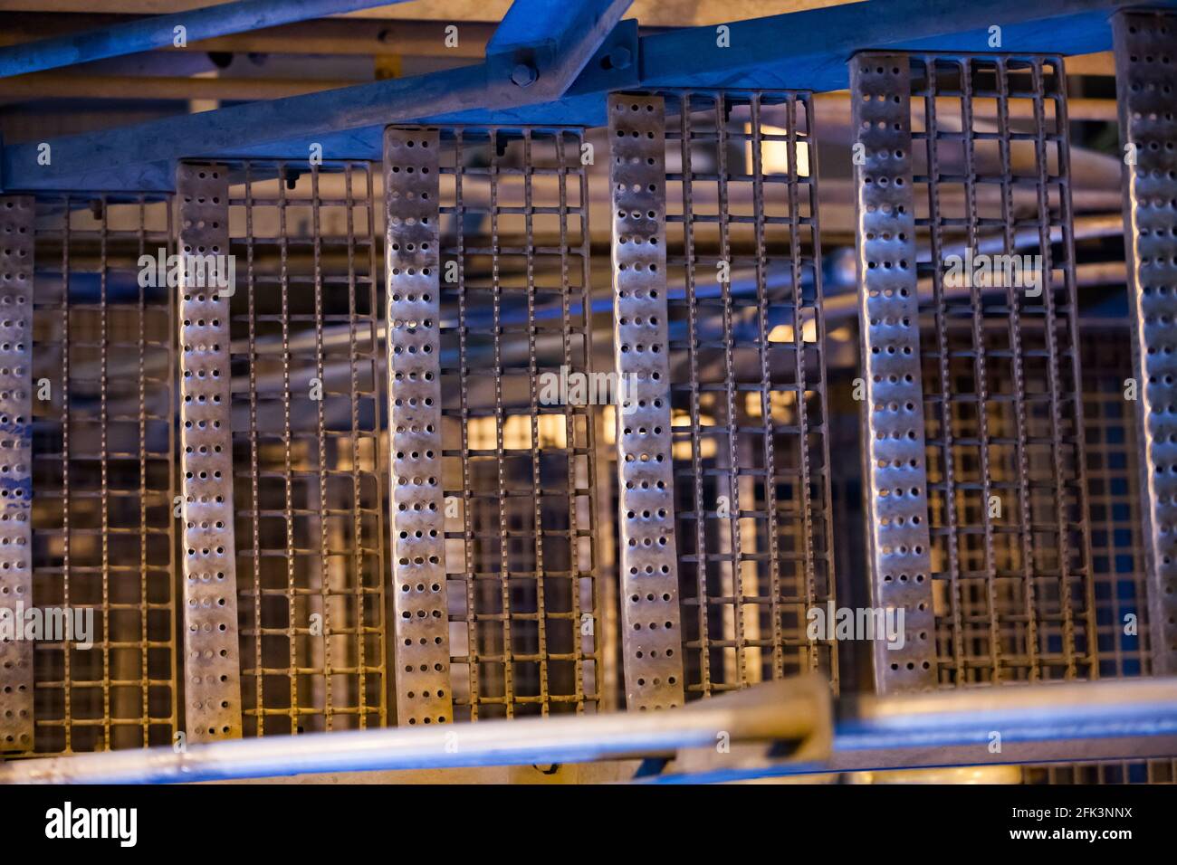 Metal grid stair. Oil refinery. Anti-slip qualities of the step. Safety ...