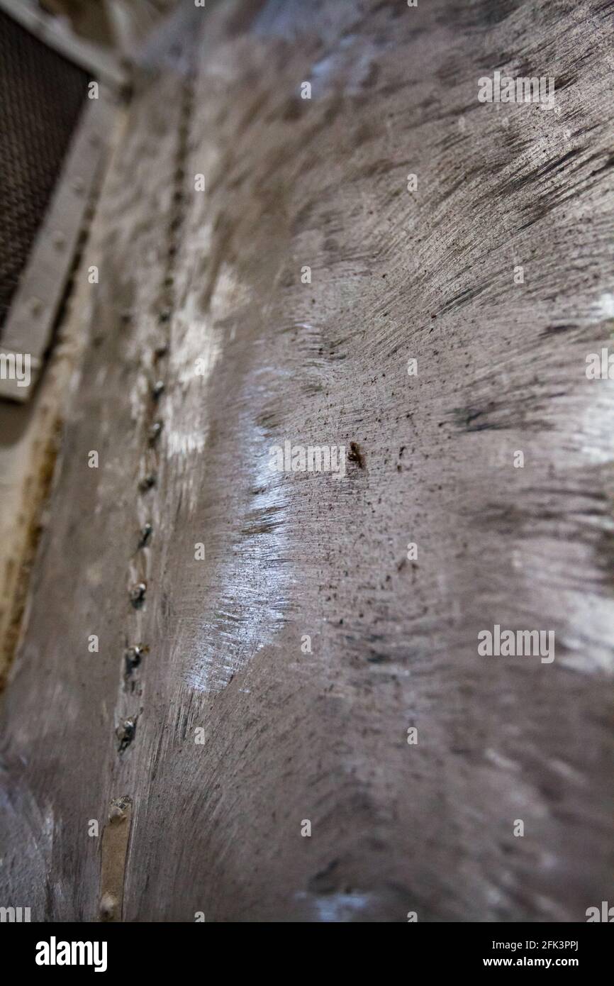 Closeup photo of rough grinding surface of metal before painting. Some ...