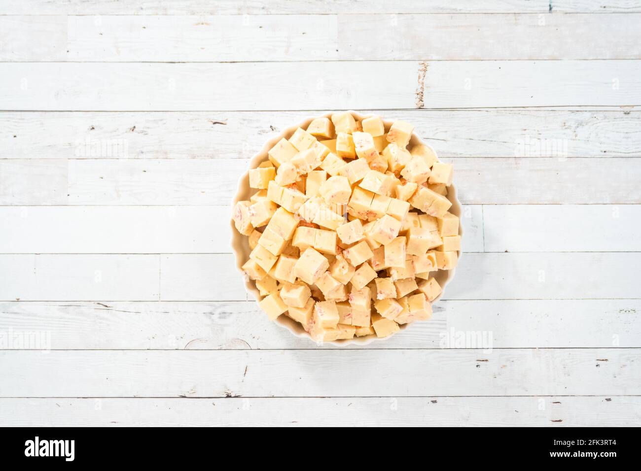 Flat lay. Cutting candy cane fudge into small cubes Stock Photo - Alamy
