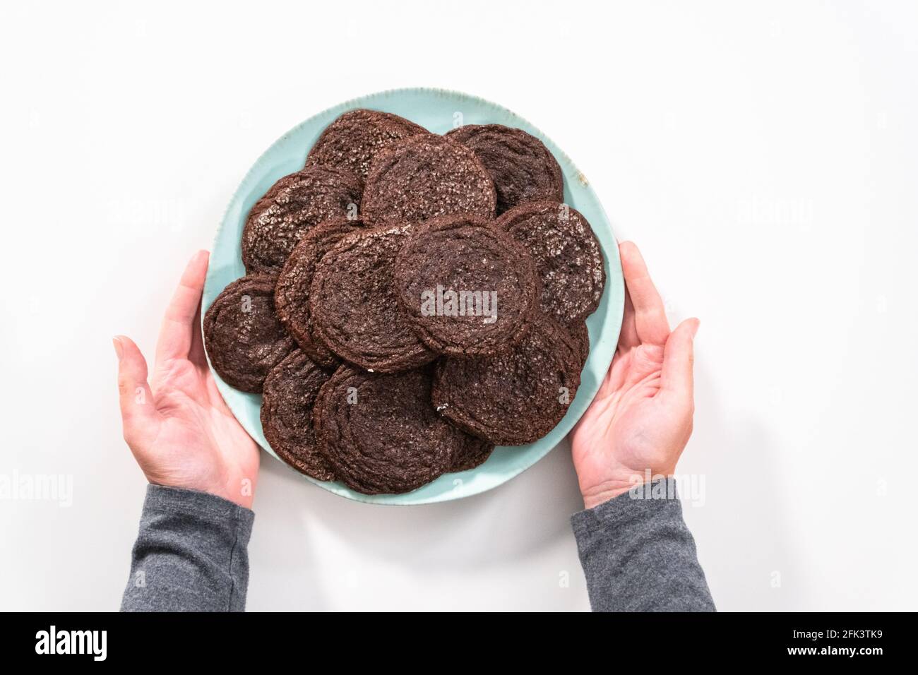 Flat lay. Freshly baked chocolate cookies on a blue plate Stock Photo ...