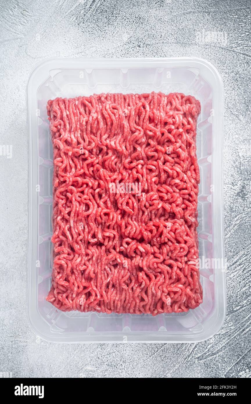 Fresh Raw mince beef and pork meat in vacuum packaging. White ...