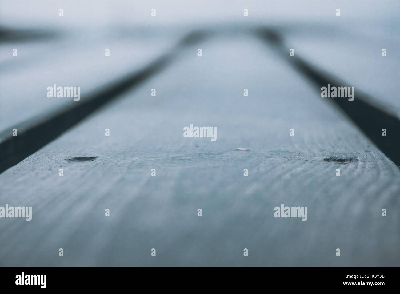 Close up shot of an outdoor wood table after rain Stock Photo - Alamy