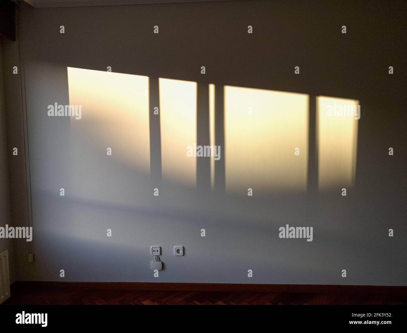 Sunlight through a window on an empty wall Stock Photo - Alamy