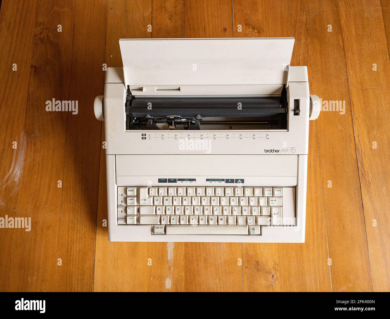 Antique electronic typewriter ready on a wood desk Stock Photo - Alamy