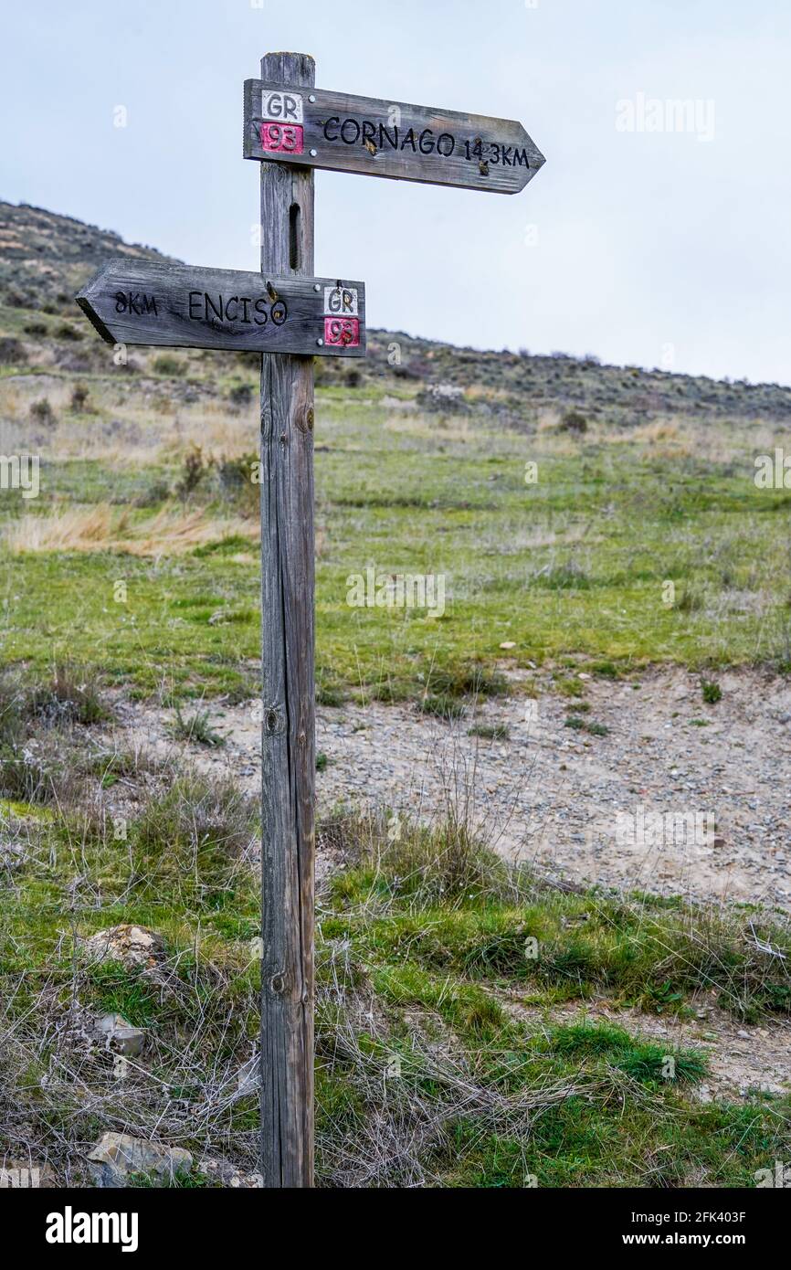 Wooden signpost with an arrow, for mountain routes or visitation areas ...