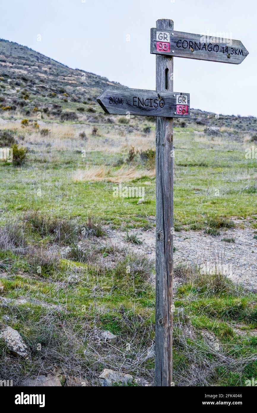 Wooden signpost with an arrow, for mountain routes or visitation areas ...