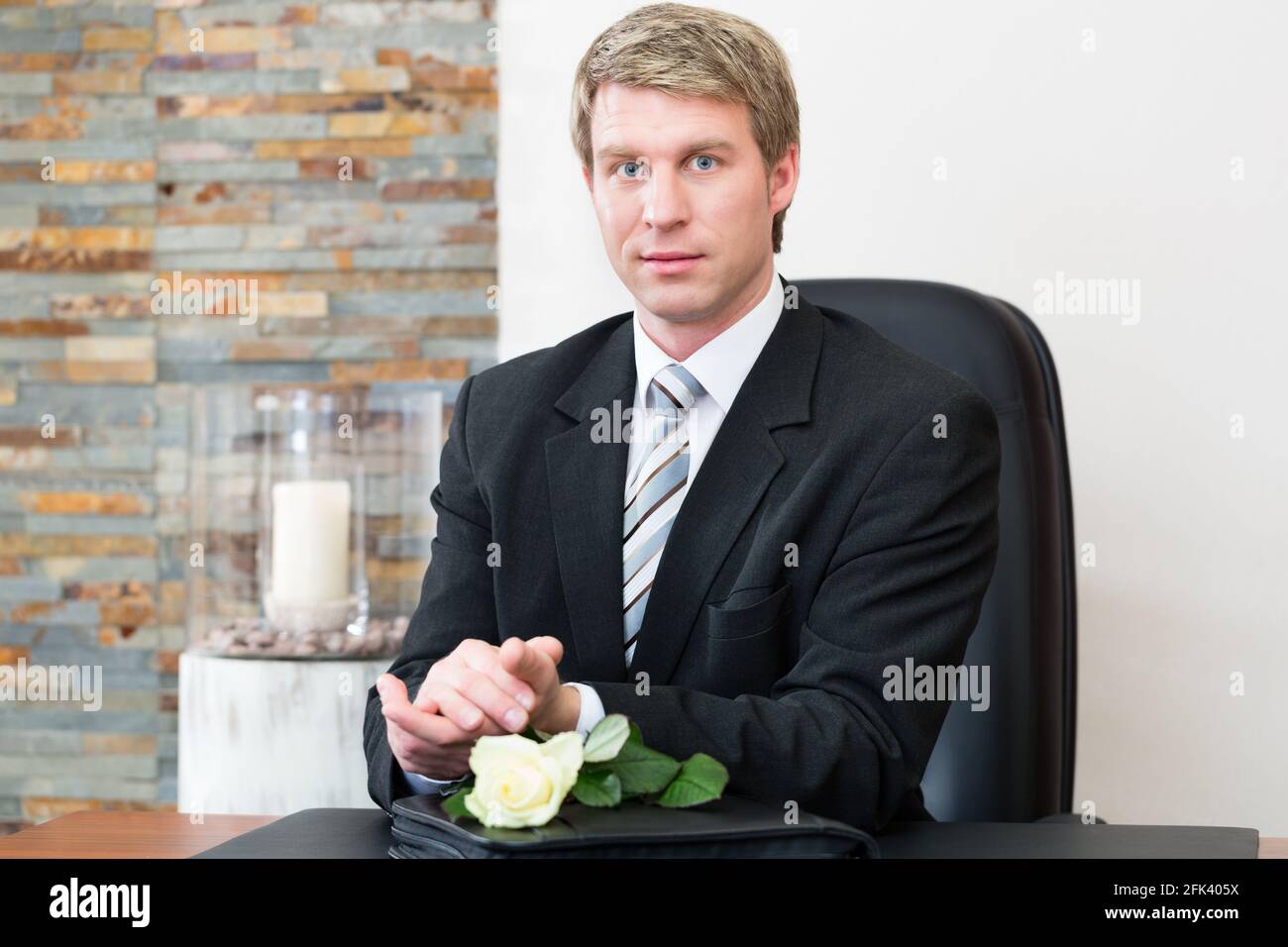 Undertaker in his store with a display of coffins Stock Photo - Alamy
