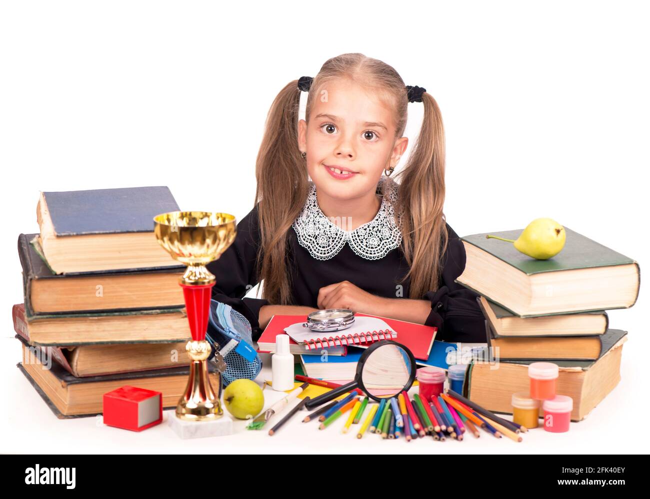 schoolgirl with books and school supplies isolated on white background ...