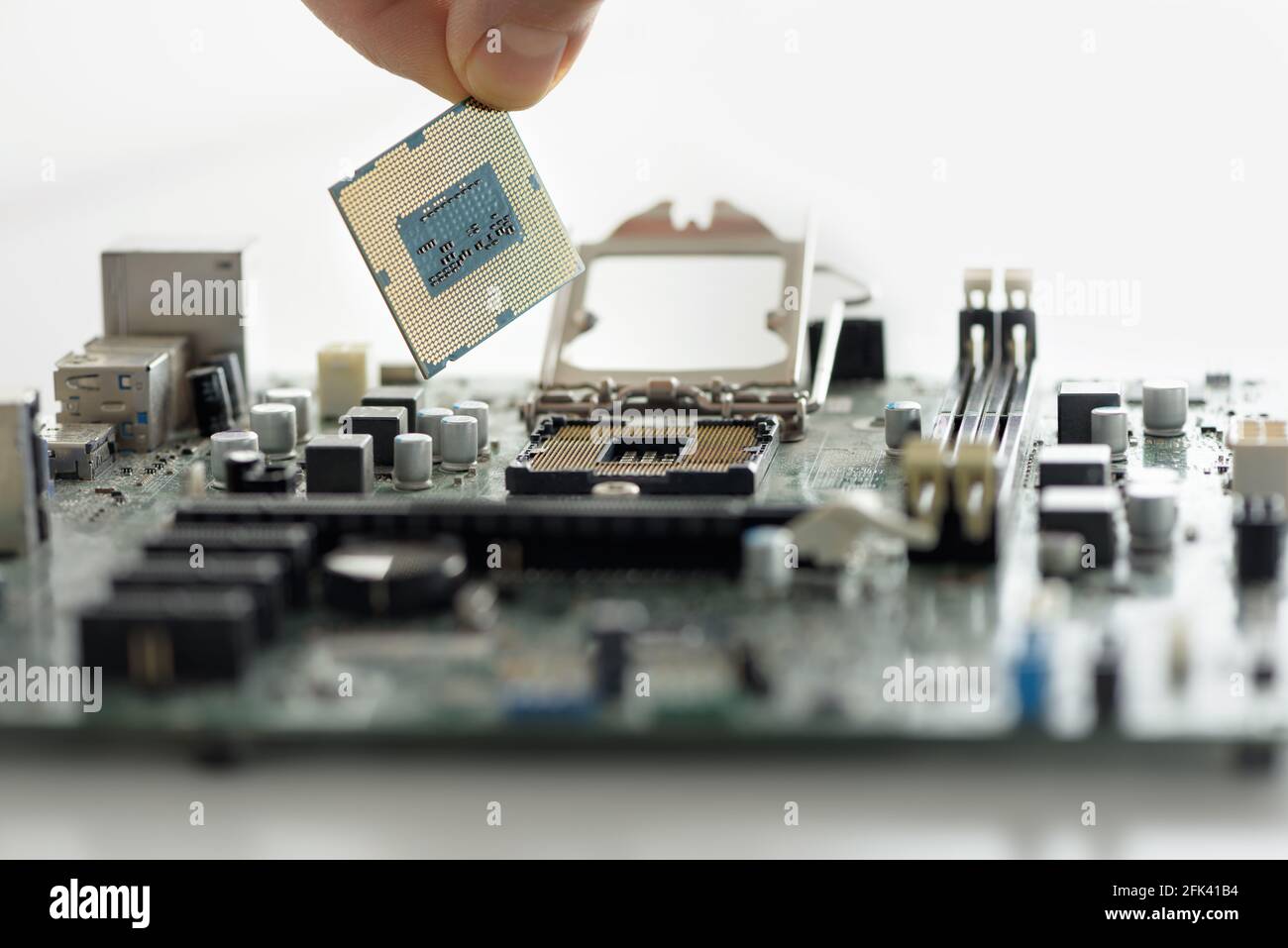 The human hand is installing the processor on the motherboard Stock ...