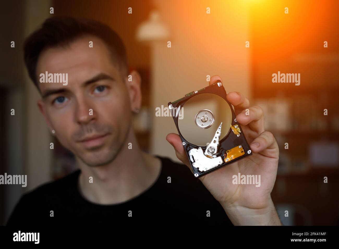 Man holding hard disk hi-res stock photography and images - Alamy