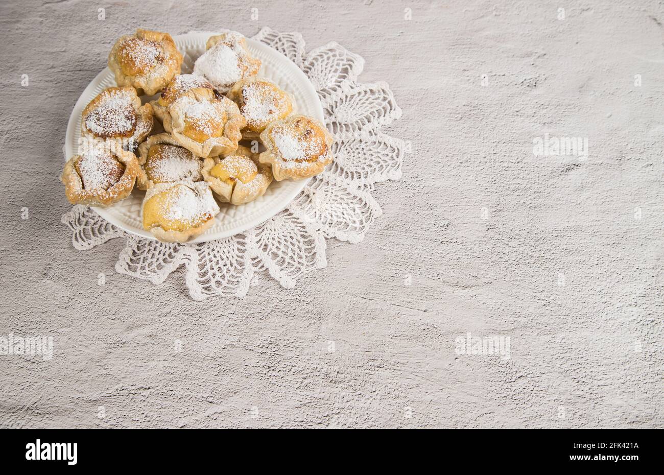 Traditional Portuguese homemade puff pastry with egg cream on a light ...