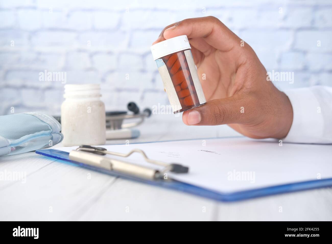 Doctor hand holding pill container hi-res stock photography and images ...