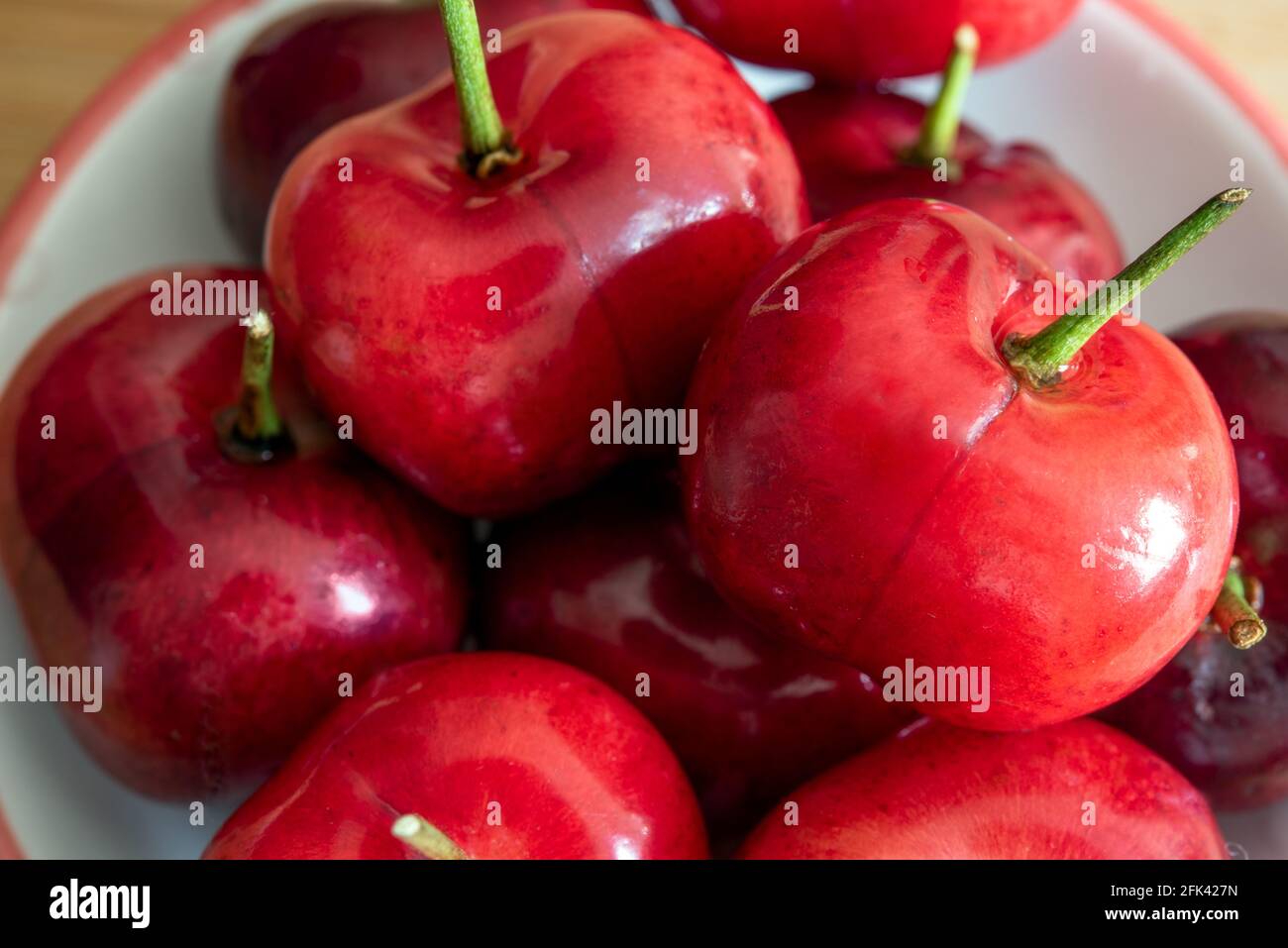 Fresh red cherries over cutting board Stock Photo - Alamy