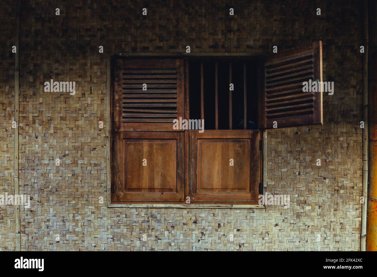 Wooden windows with bars of old vintage building, Indonesia Stock Photo ...