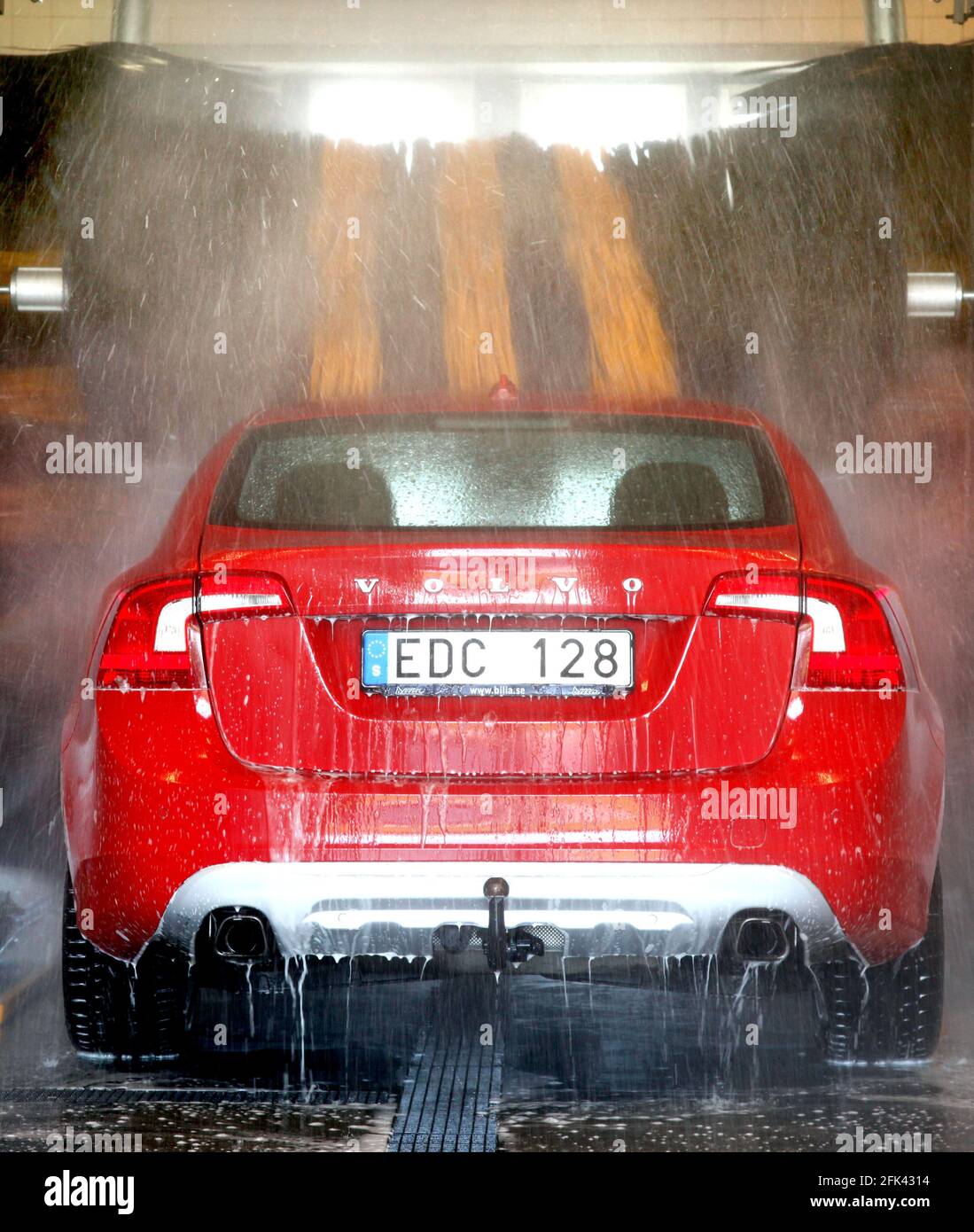 Red Volvo at Statoil's automatic car wash Stock Photo - Alamy