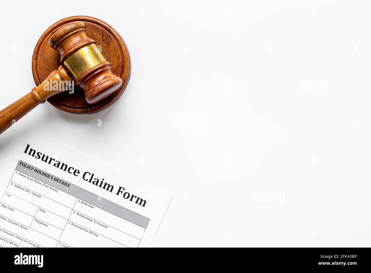 Insurance claim form with judge gavel . Top view Stock Photo - Alamy