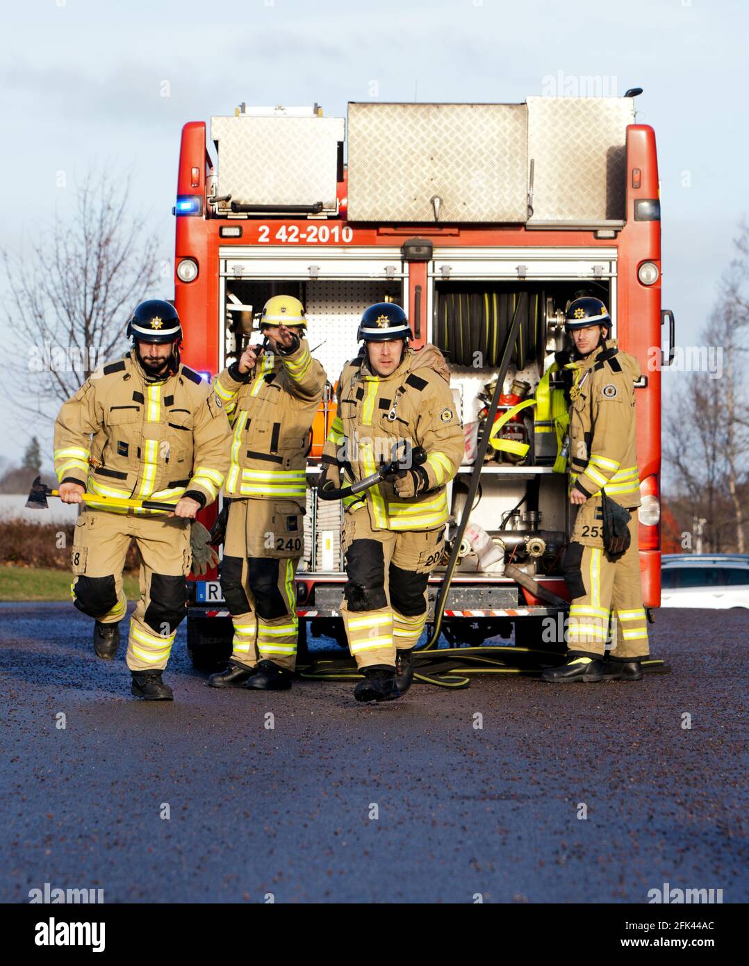 Fire-fighters on site at a fire scene Stock Photo - Alamy