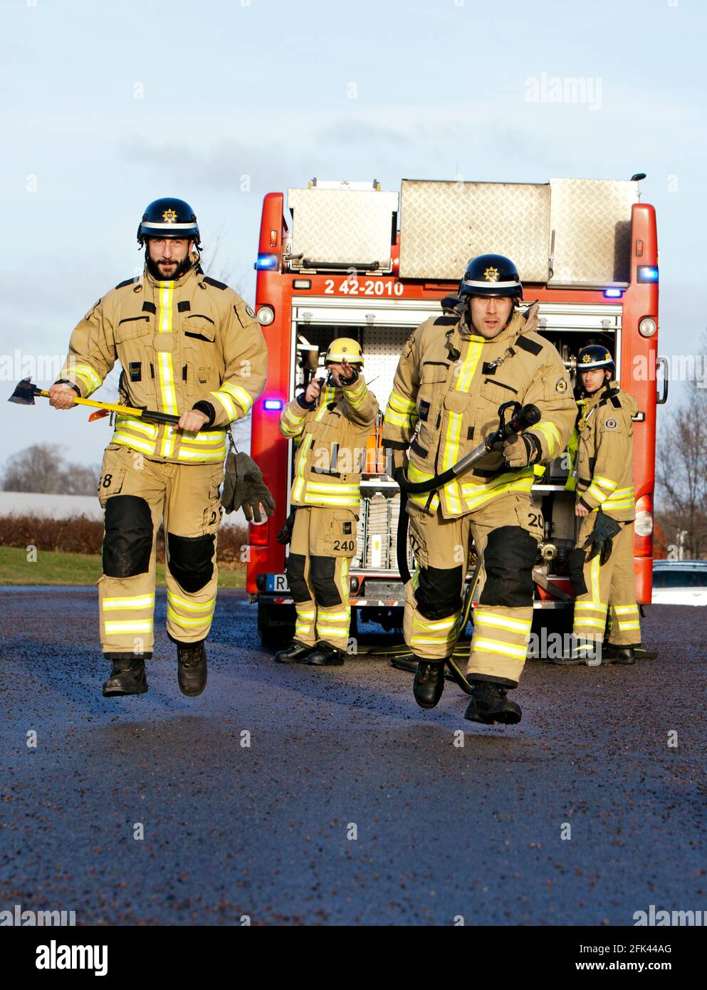 Fire-fighters on site at a fire scene Stock Photo - Alamy