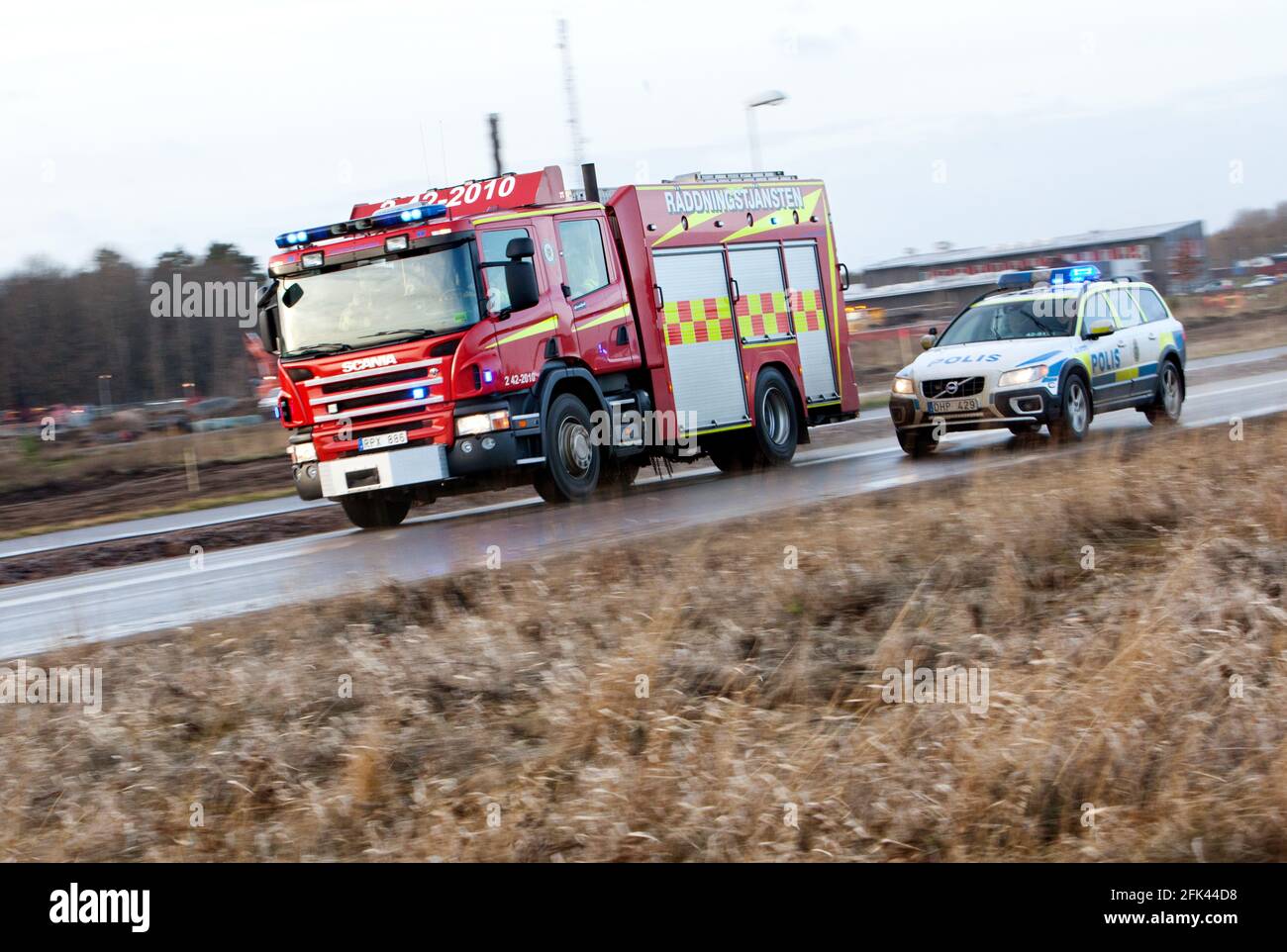 A police car and a rescue vehicle from the rescue service during an ...