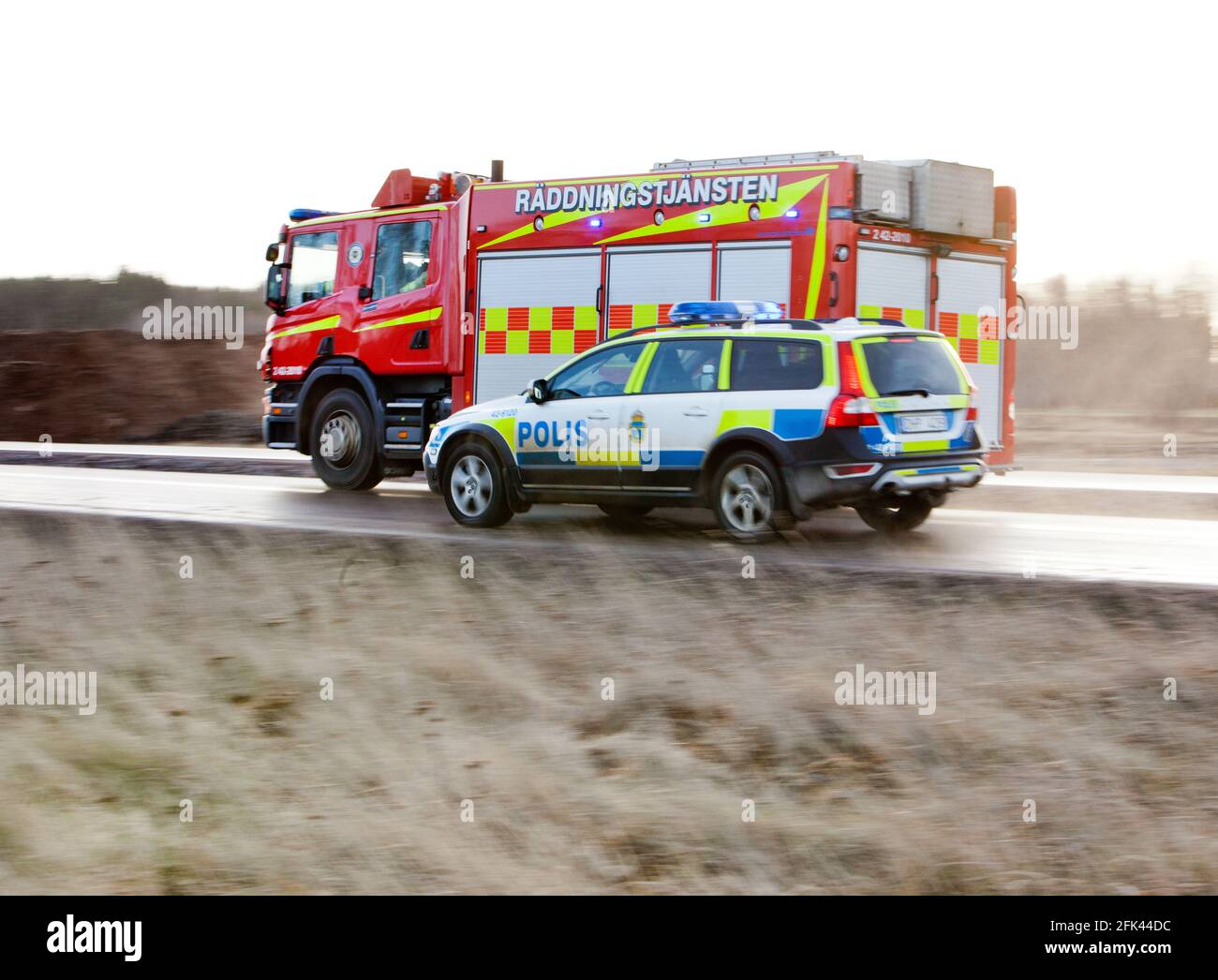 A police car and a rescue vehicle from the rescue service during an ...
