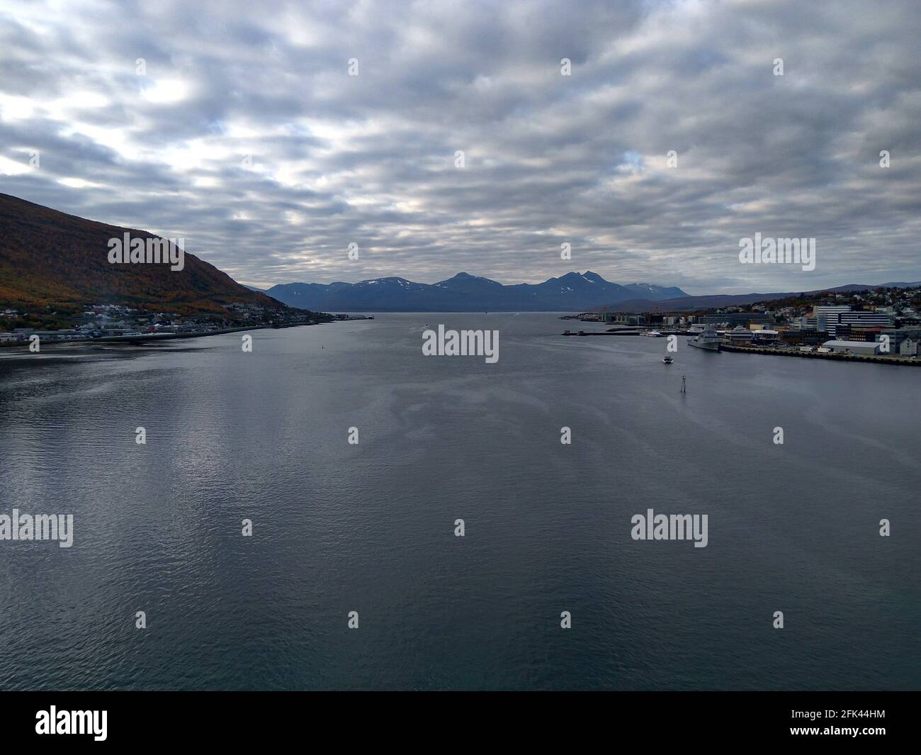 Aerial view from a bridge to a fjord on background of Tromso cityscape ...