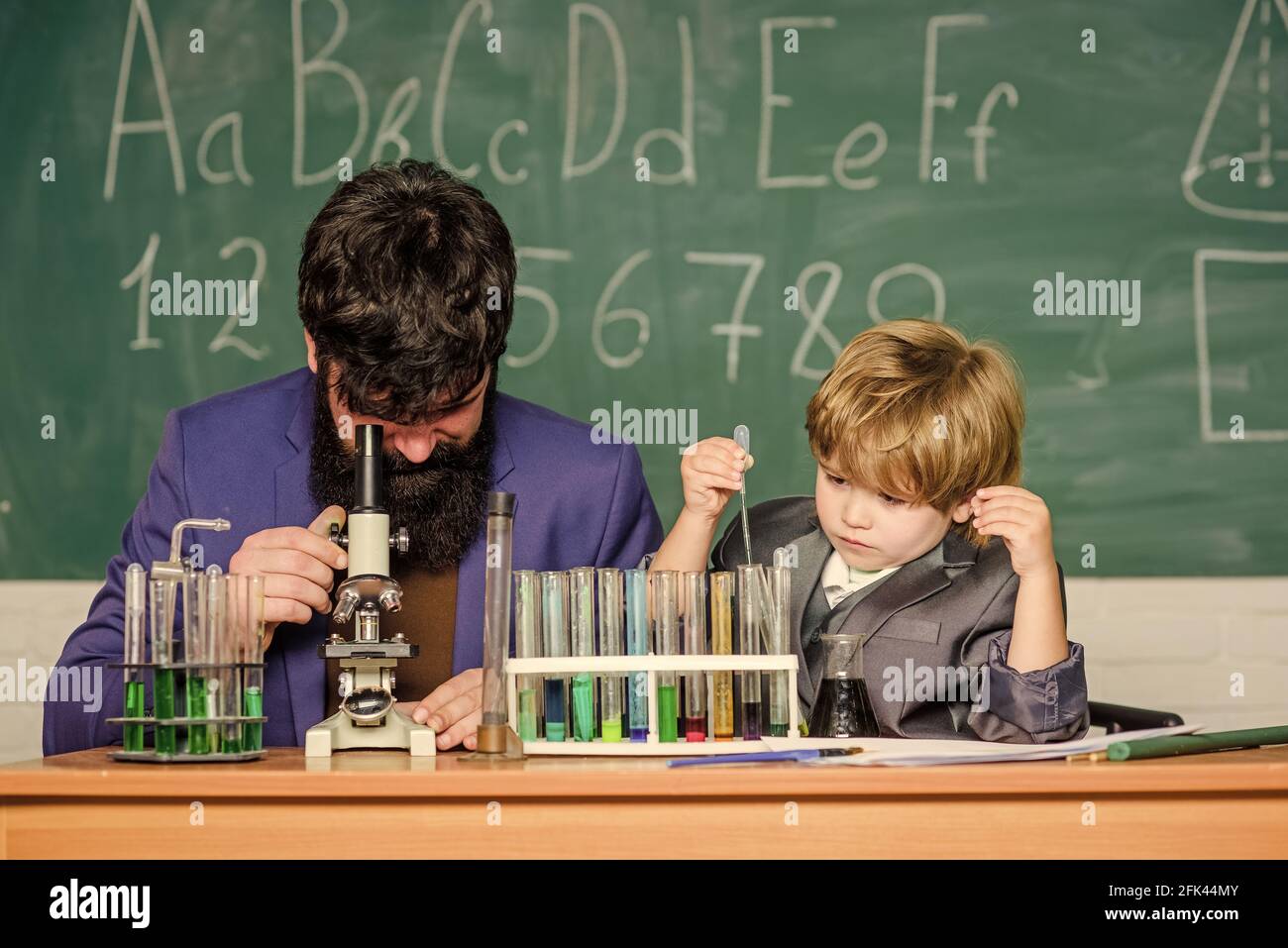 educations motivation. Flask in scientist hand with Test tubes ...