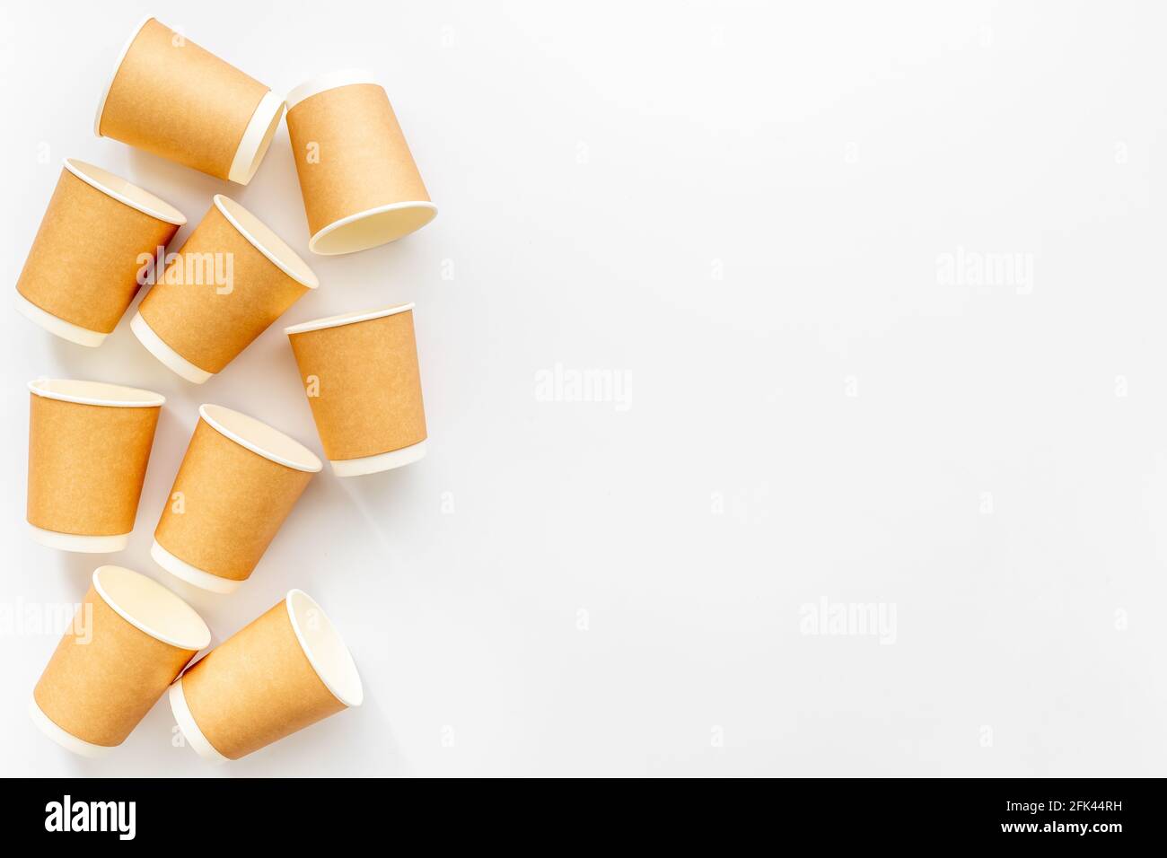 Layout of coffee paper cups. Overhead view Stock Photo - Alamy