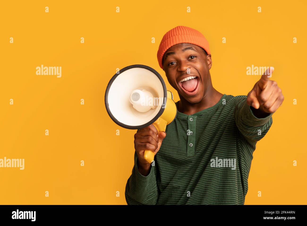 Cheerful positive man with loudspeaker hi-res stock photography and ...